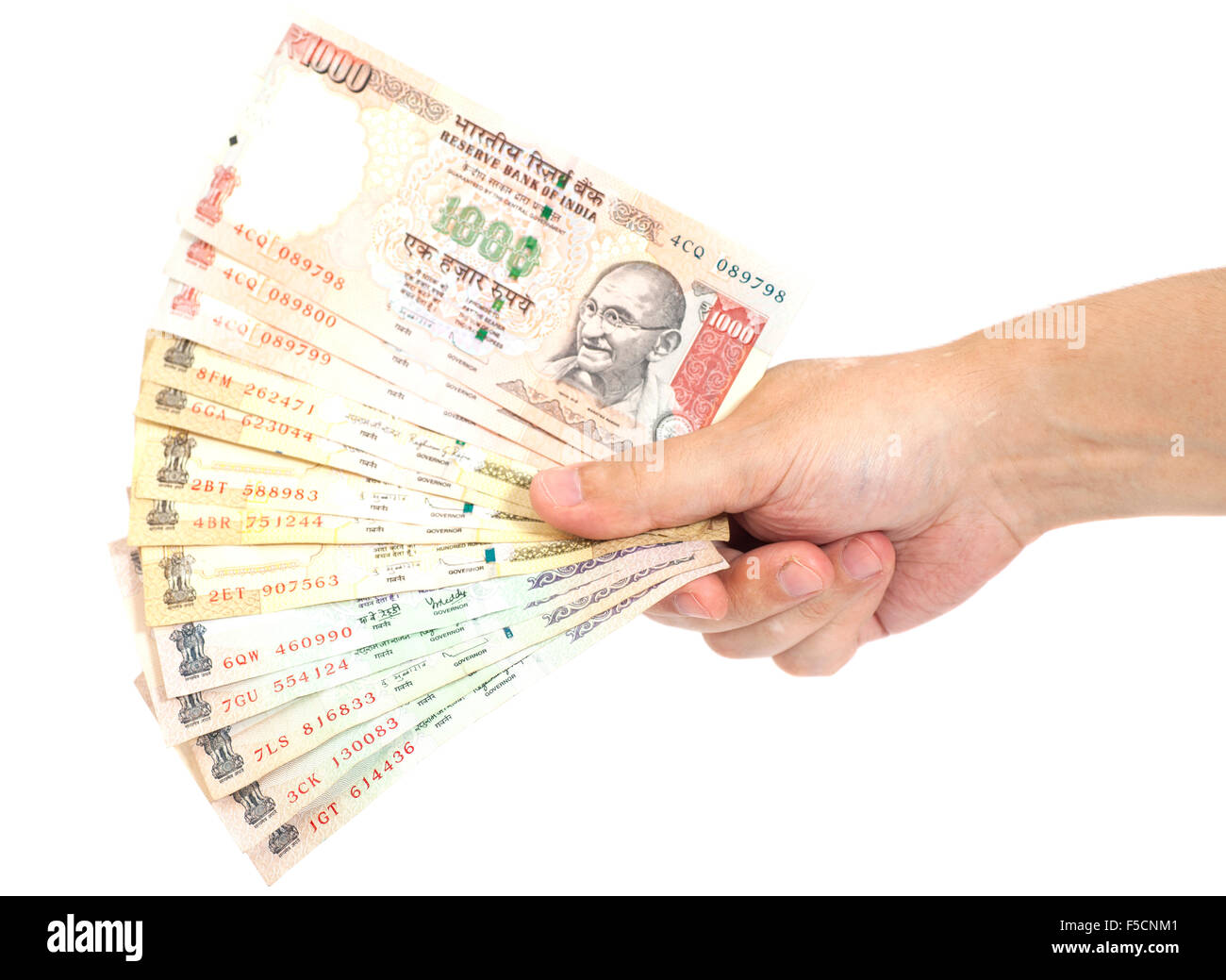 Hand with Indian thousand rupee notes isolated Stock Photo - Alamy