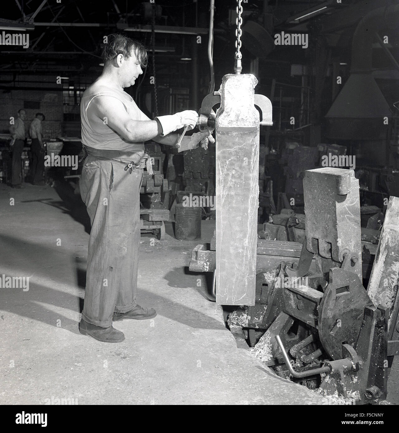 1950s historical, man working in a cast iron foundry, London, England ...