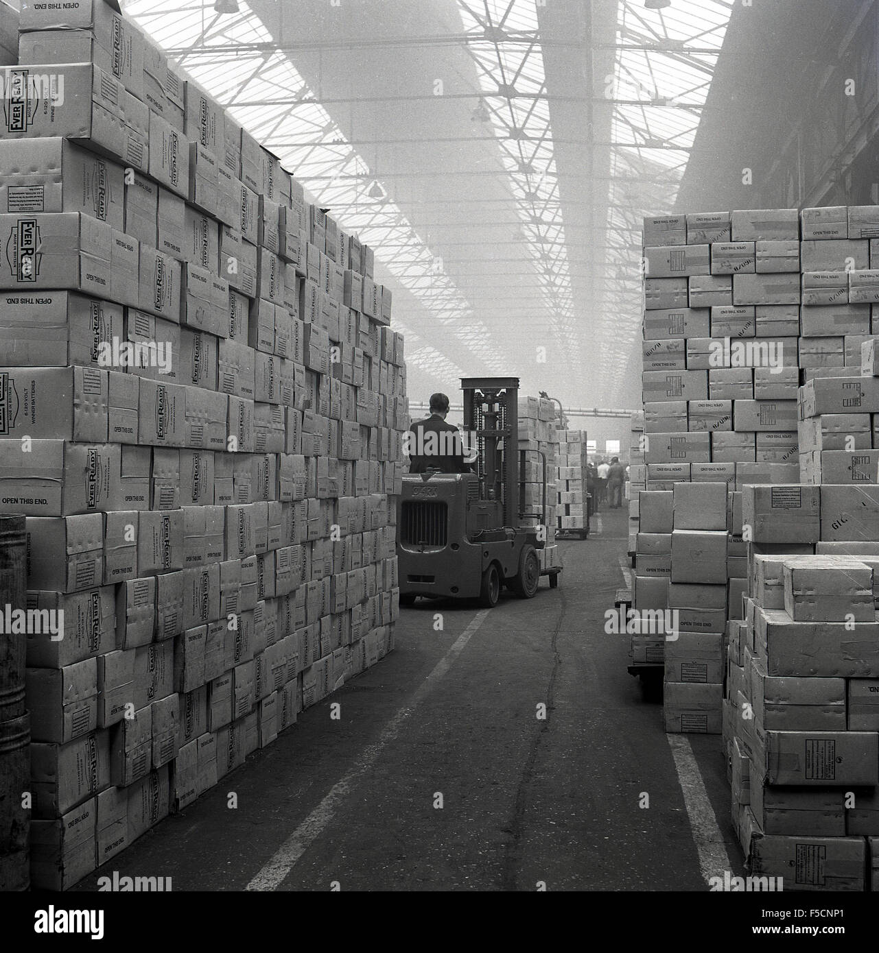1950s historical, light from rooftop windows fill a large industrial ...