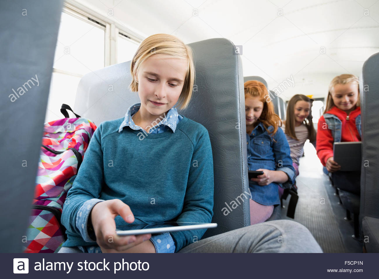 Child on school bus tablet hi-res stock photography and images - Alamy
