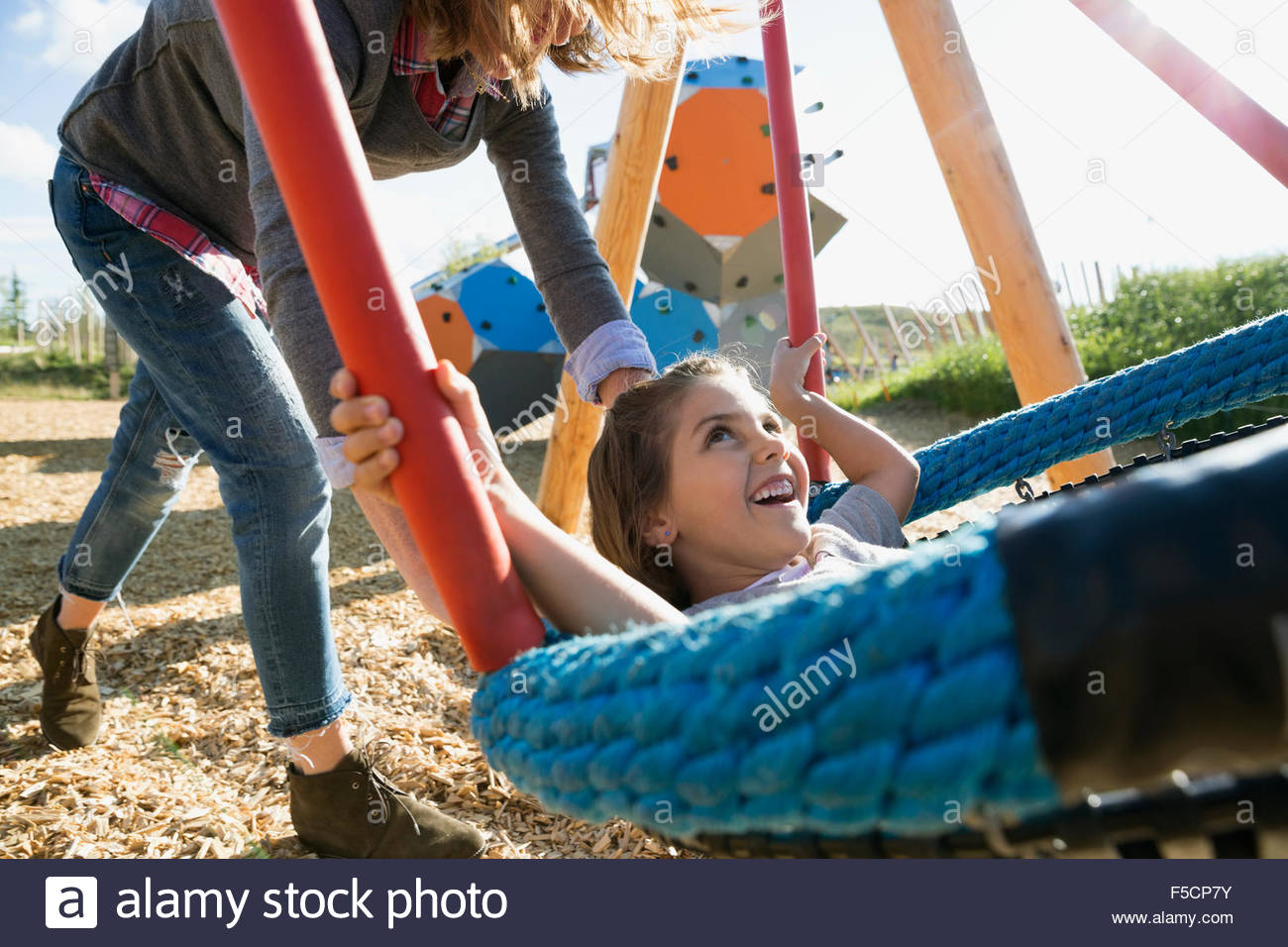 Parent pushing child swing hi-res stock photography and images - Alamy
