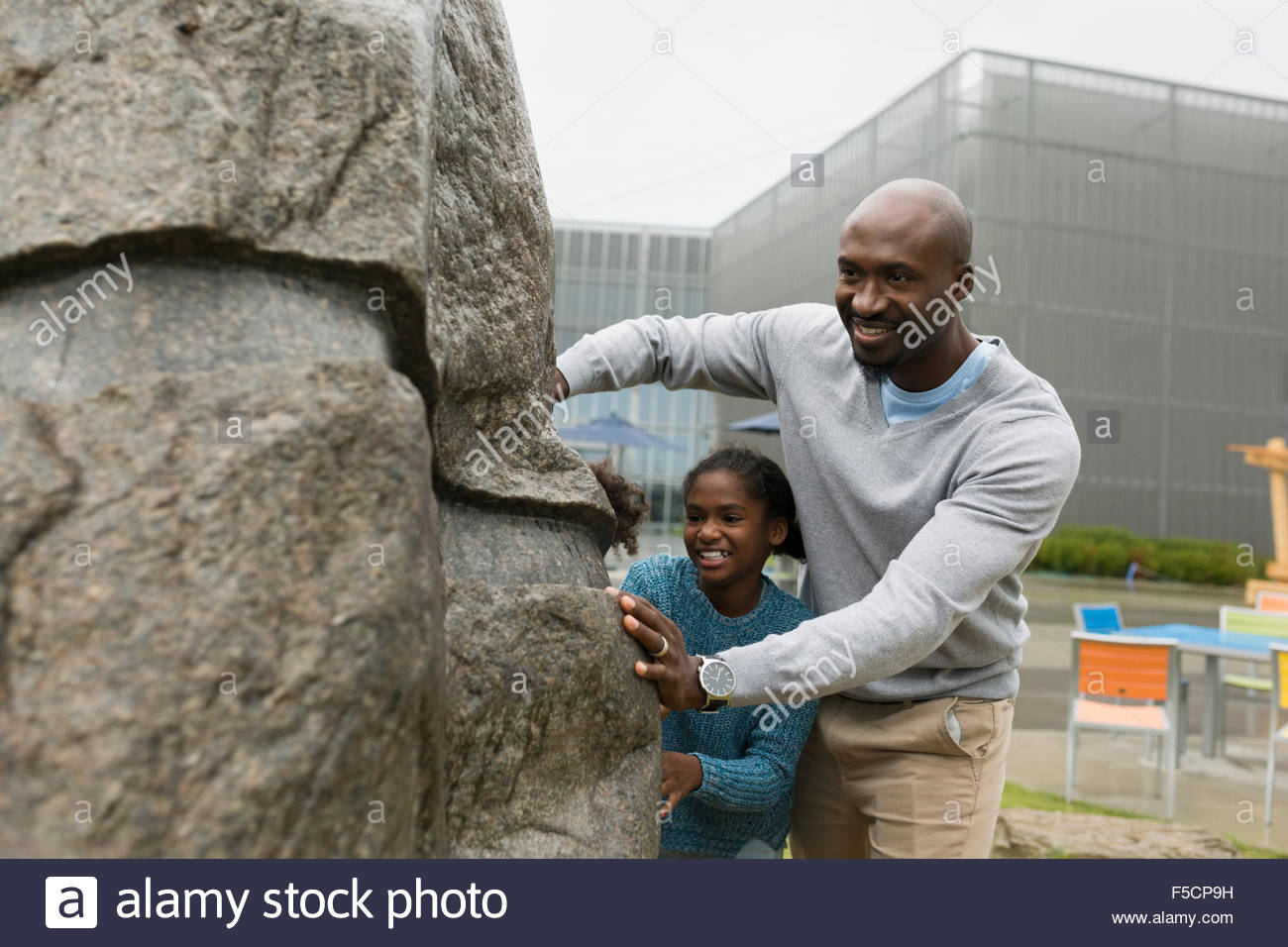 Man pushing boulder hi-res stock photography and images - Alamy
