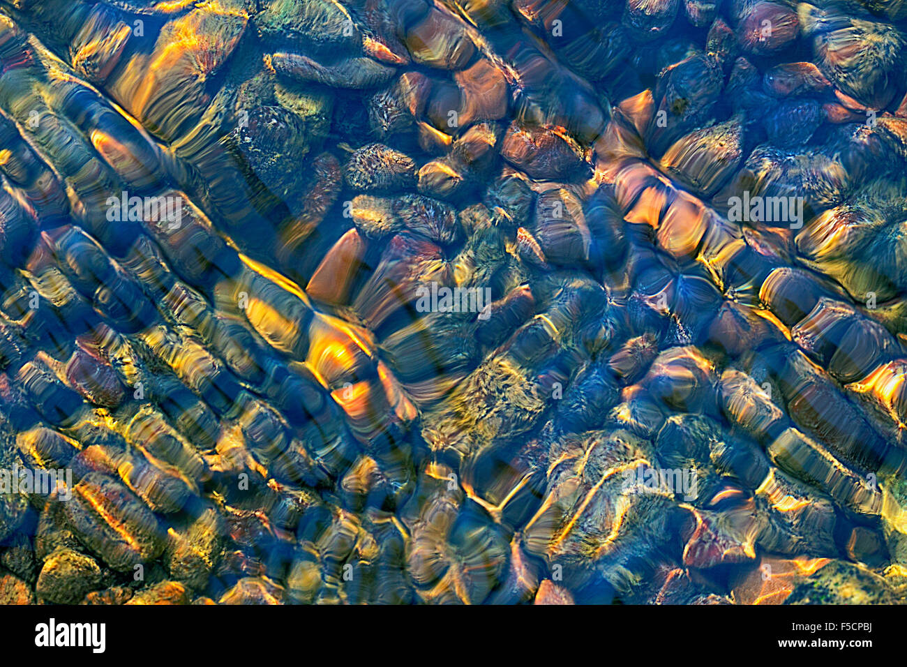 Stones under water Stock Photo - Alamy
