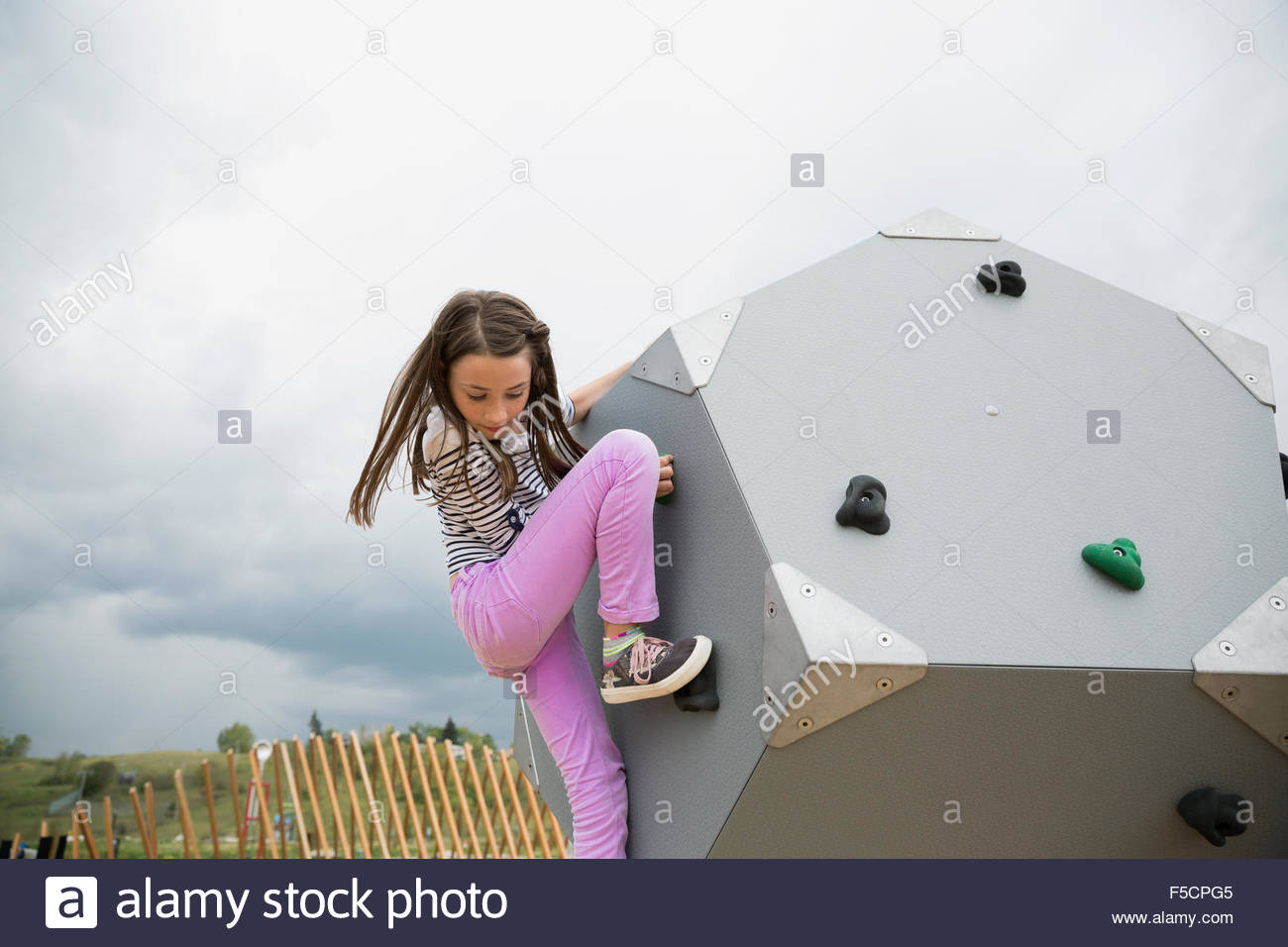 Girl child playground climbing hi-res stock photography and images - Alamy