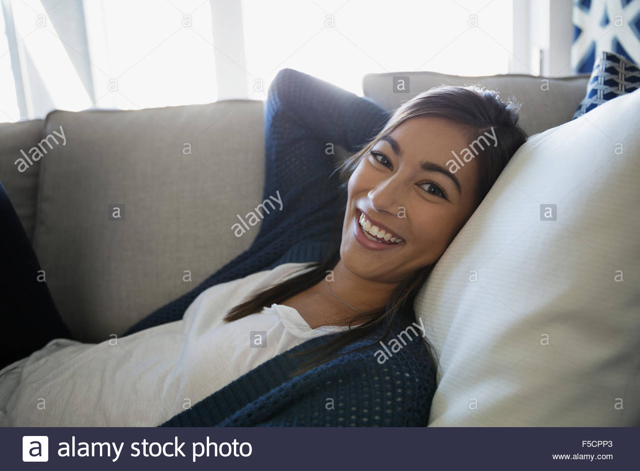 Young women laying hi-res stock photography and images - Alamy