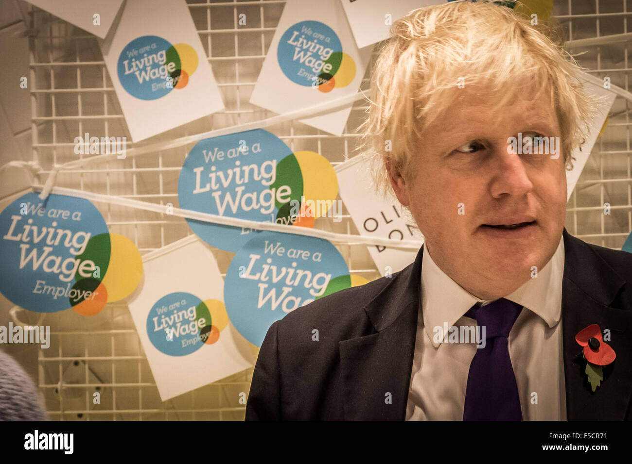 London, UK. 2nd November, 2015. Mayor Boris Johnson helps to serve ...