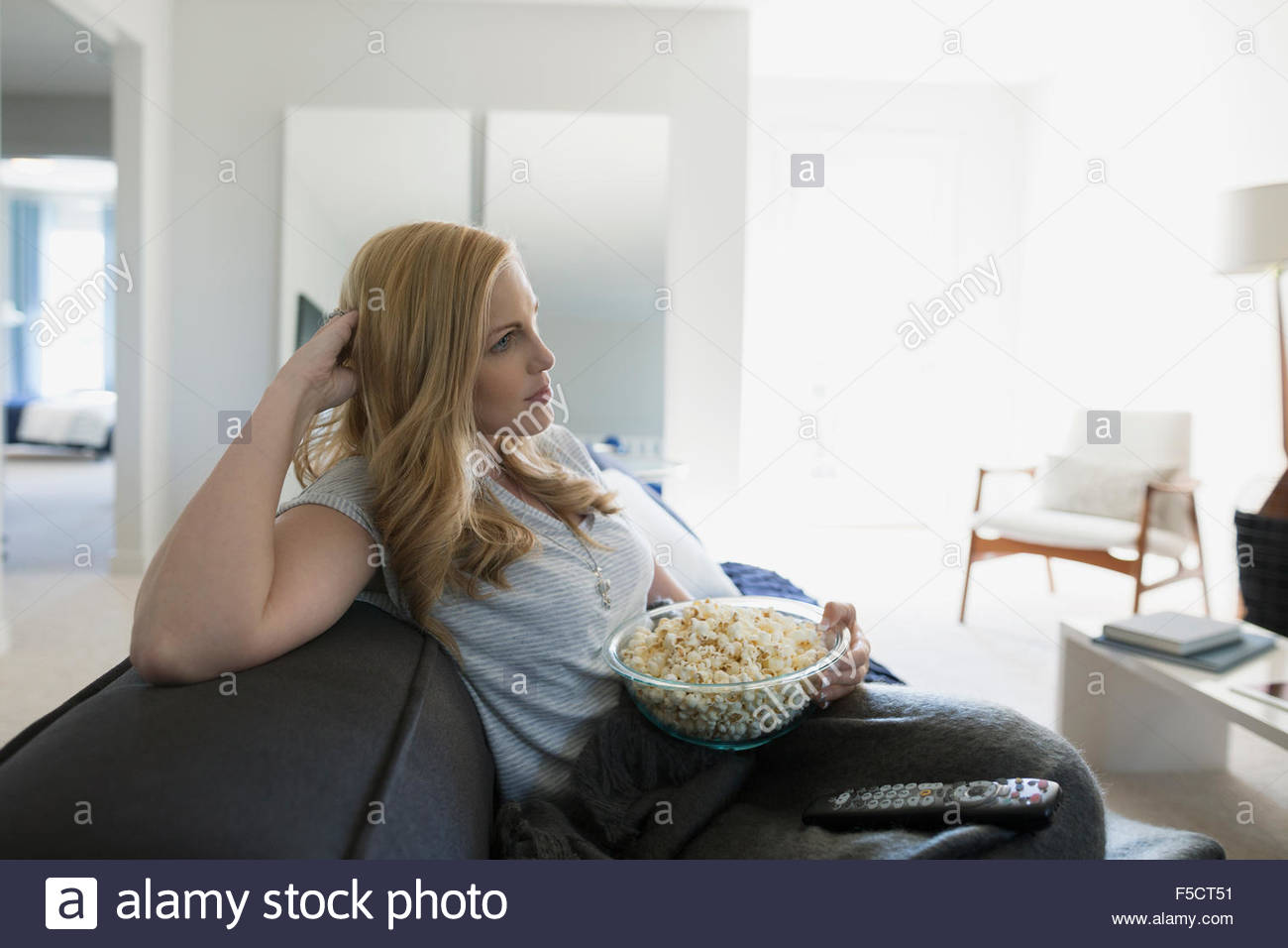 Tv watching popcorn hi-res stock photography and images - Alamy