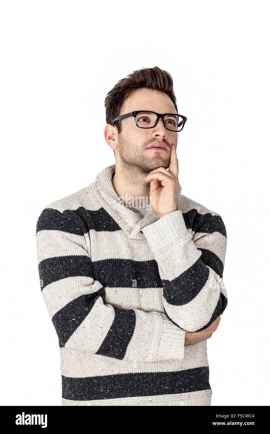 Portrait of a young man thinking, isolated against a white background ...