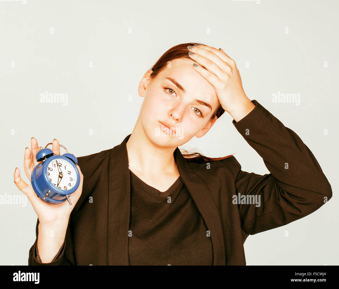 young beauty woman in business style costume waking up for work early ...