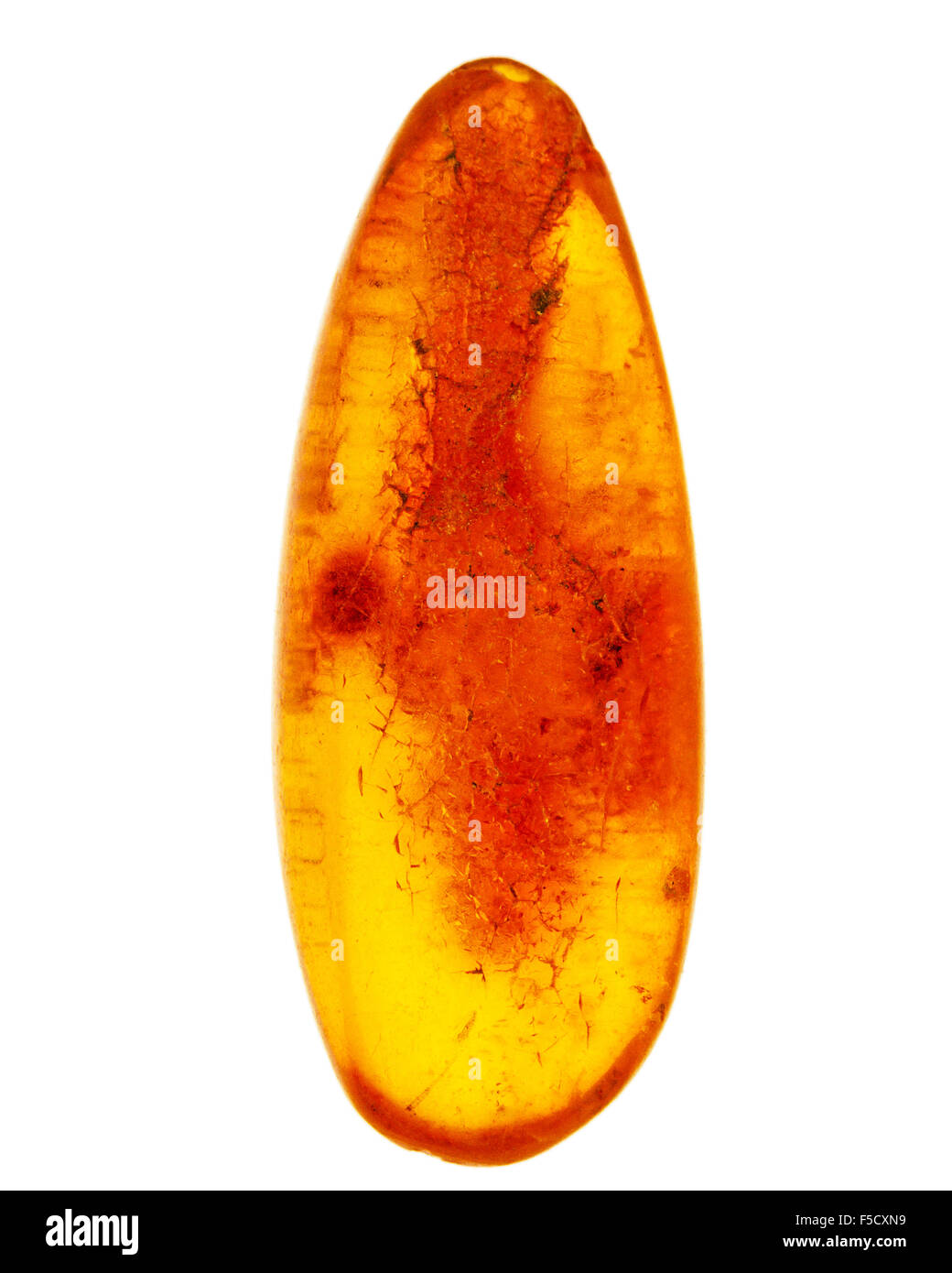 Piece of amber cutout on white background Stock Photo - Alamy
