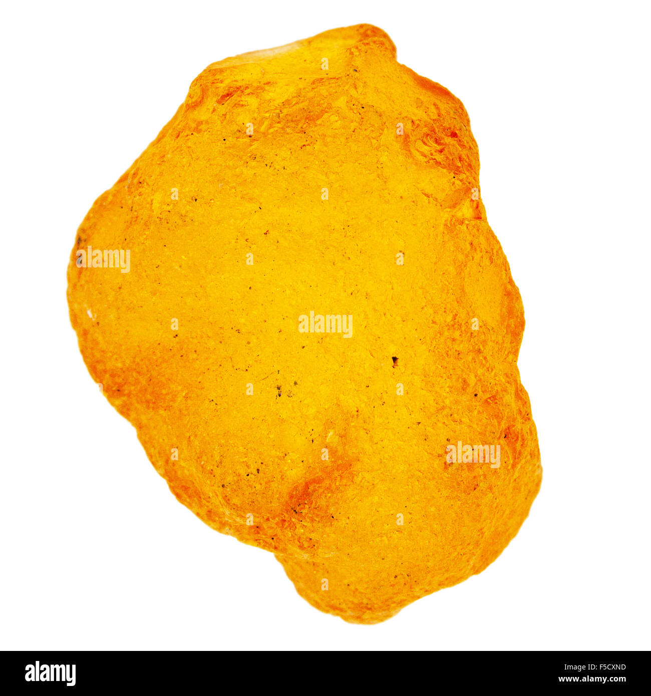Piece of amber cutout on white background Stock Photo - Alamy