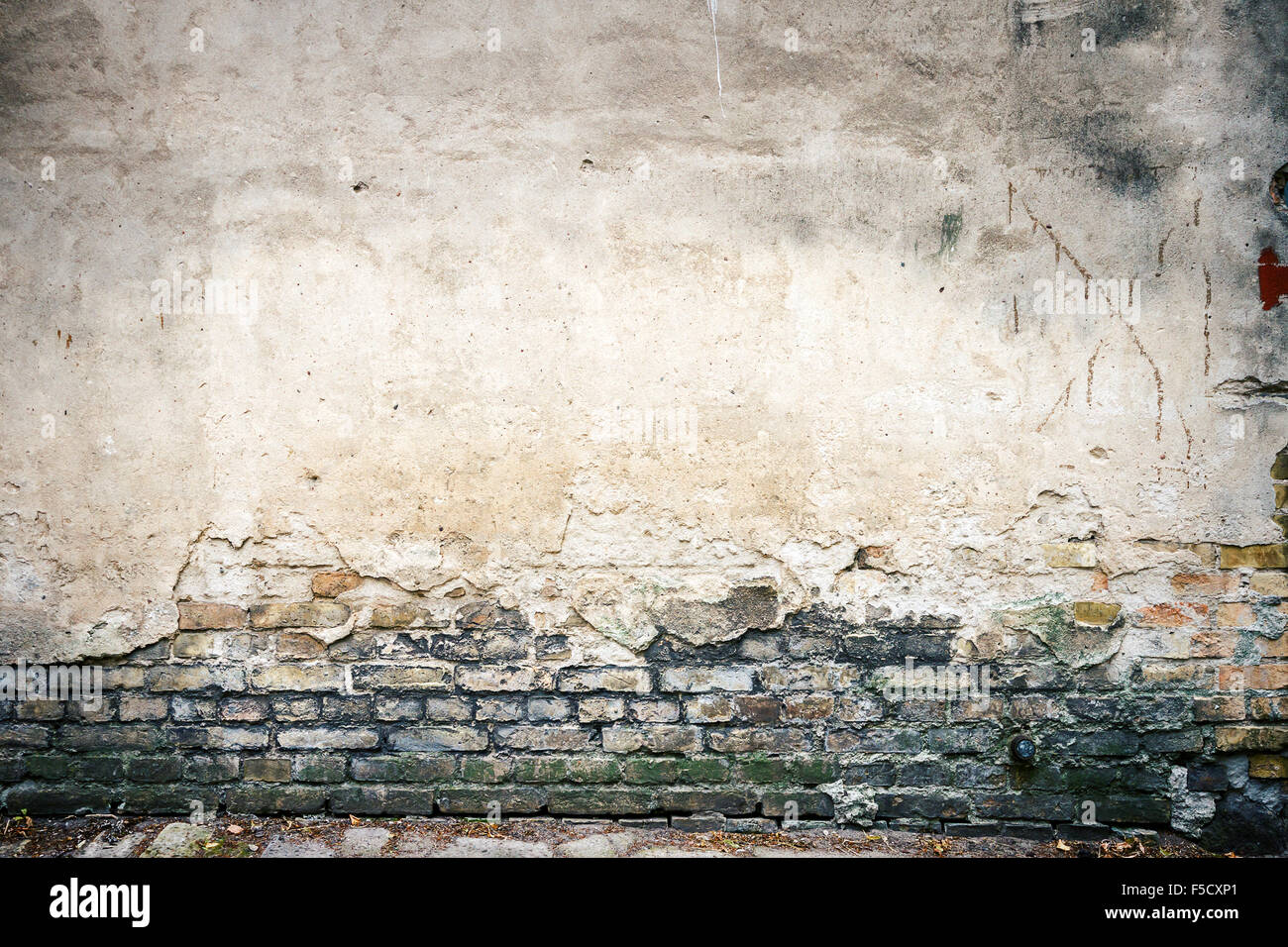 Old weathered wall of bricks and a ground Stock Photo - Alamy