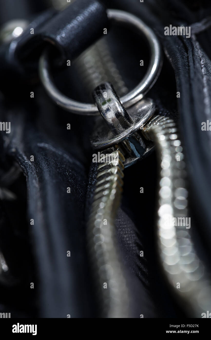Zipper of black leather bag, macro shot Stock Photo - Alamy