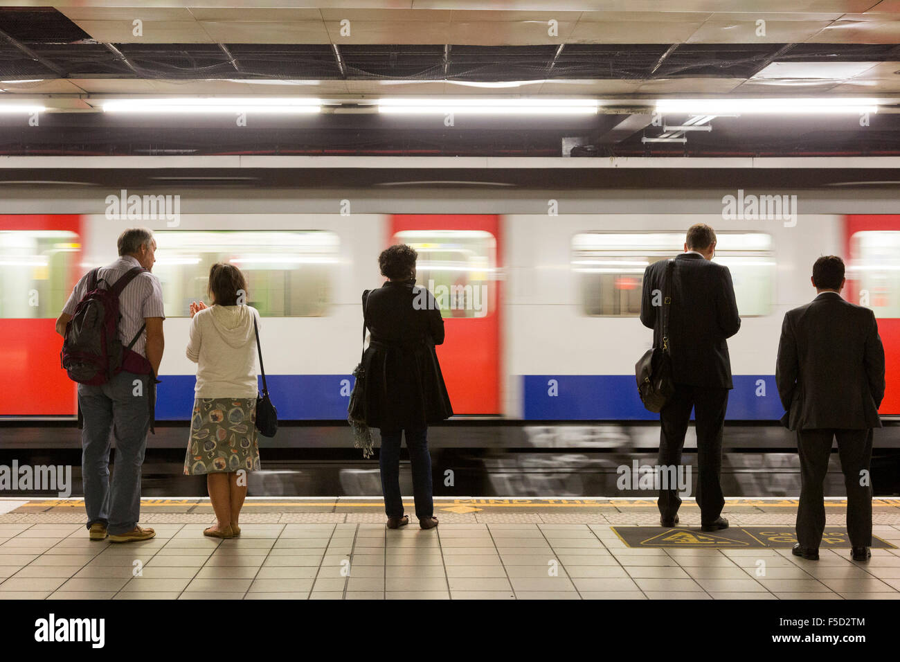 Passengers waiting for a Circle or District line Tube train on the ...