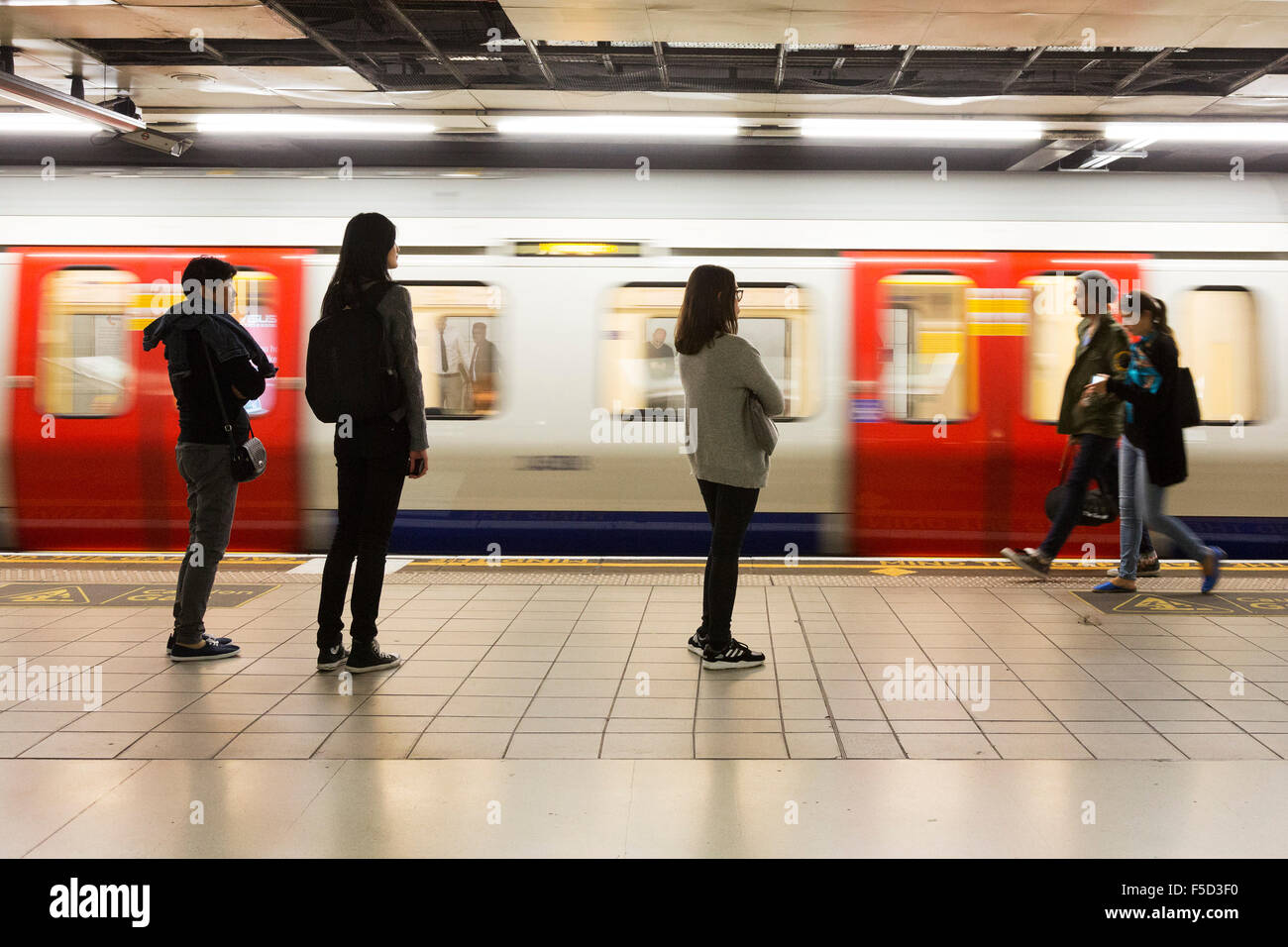 Passengers waiting for a Circle or District line Tube train on the ...