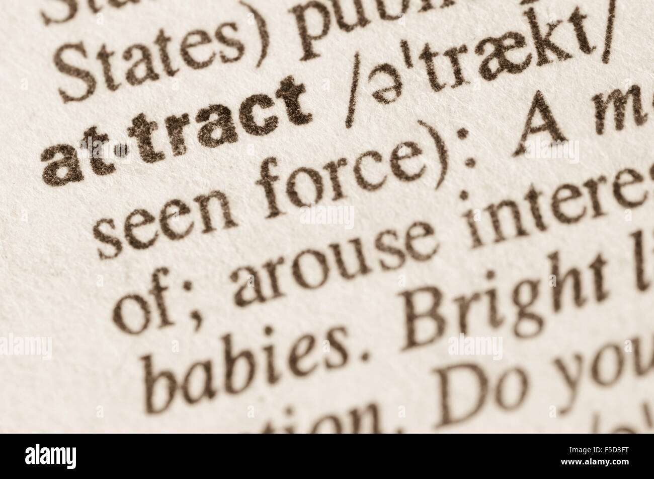 Definition of word attract in dictionary Stock Photo - Alamy