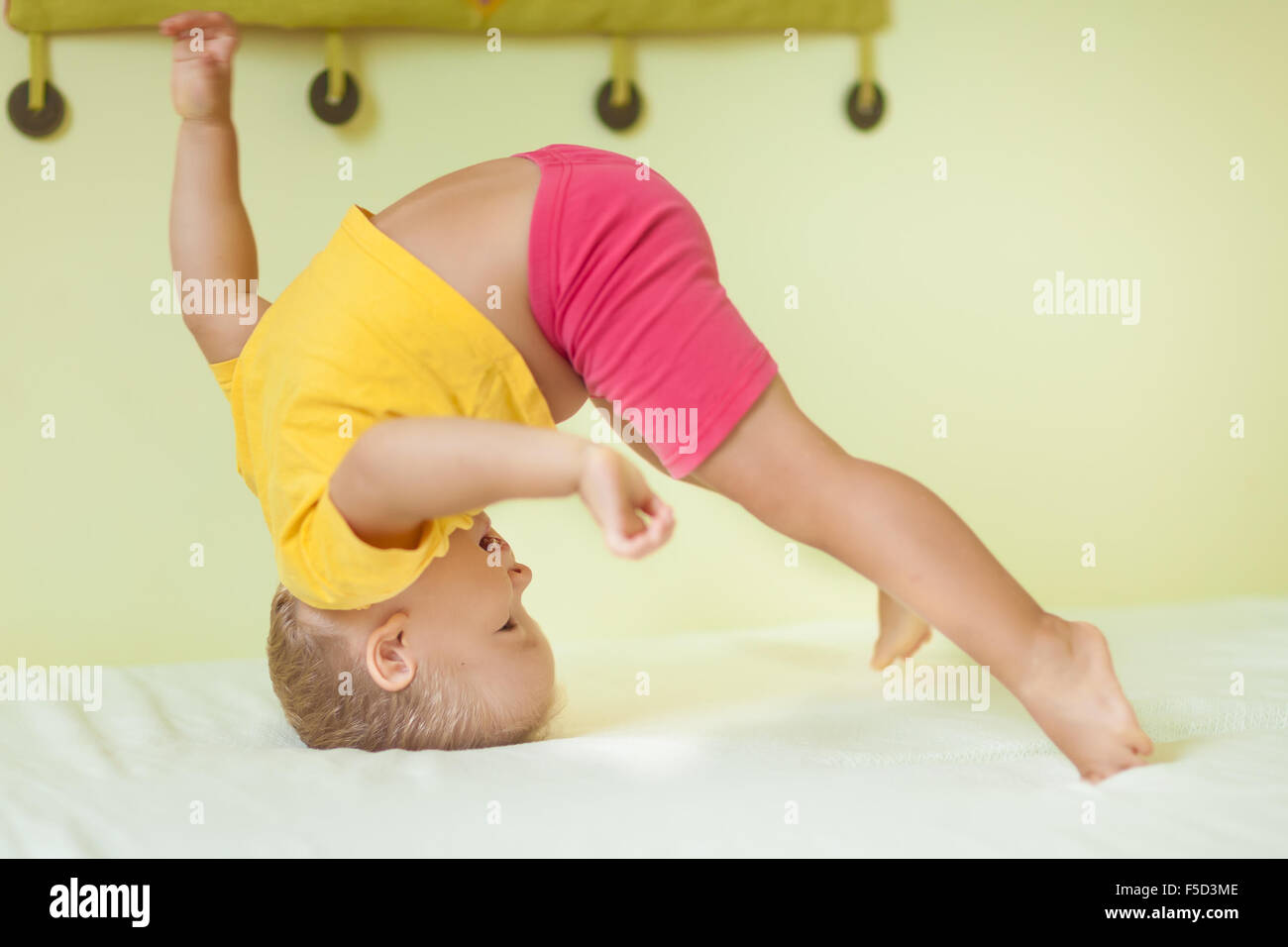 Baby boy doing exercises Stock Photo - Alamy