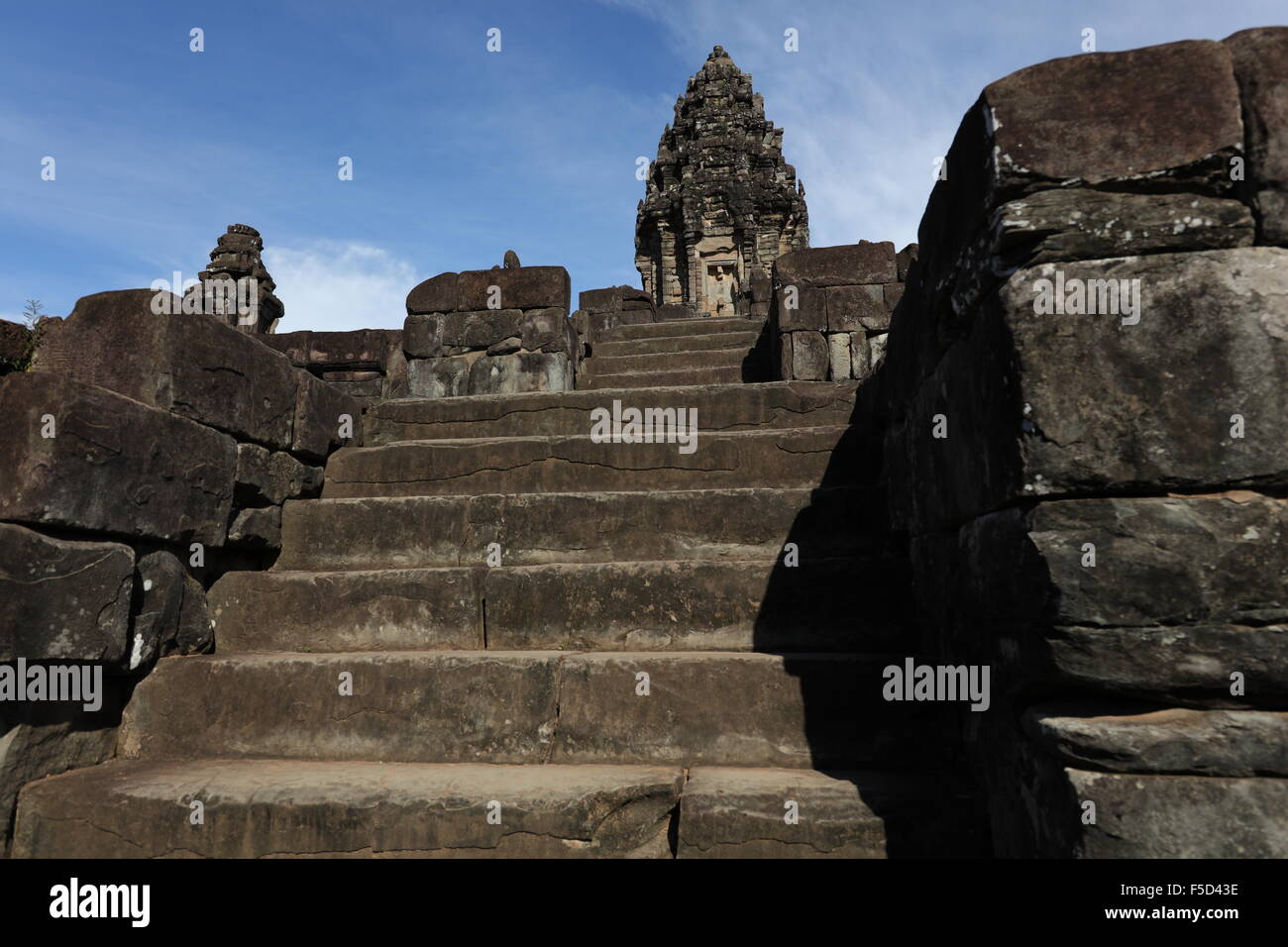 Black sandstone stairs to ruin, Angkor Wat Temple, upstairs to blue sky ...