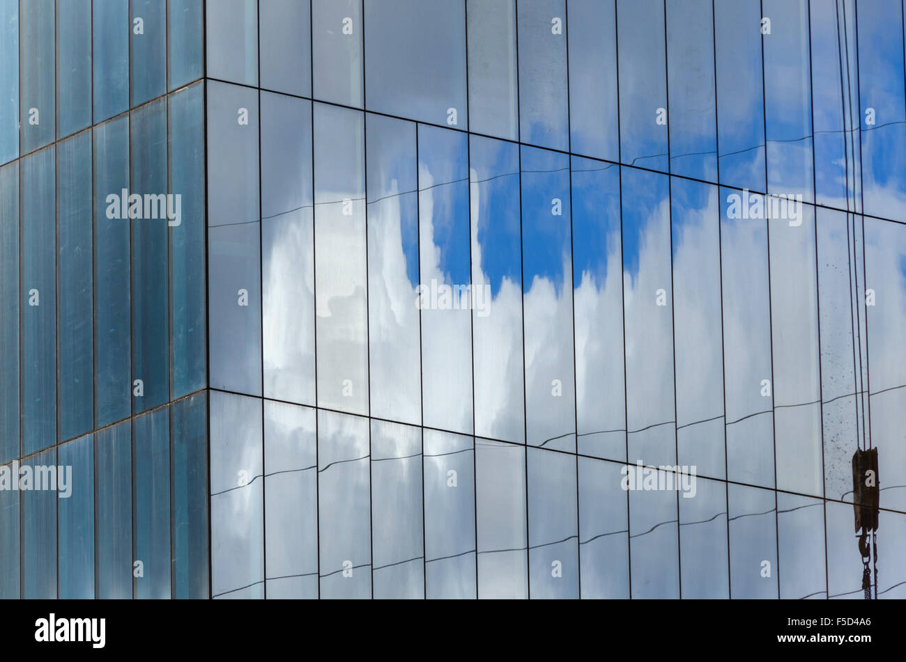 reflection of the sky on one side of a skyscraper Stock Photo - Alamy