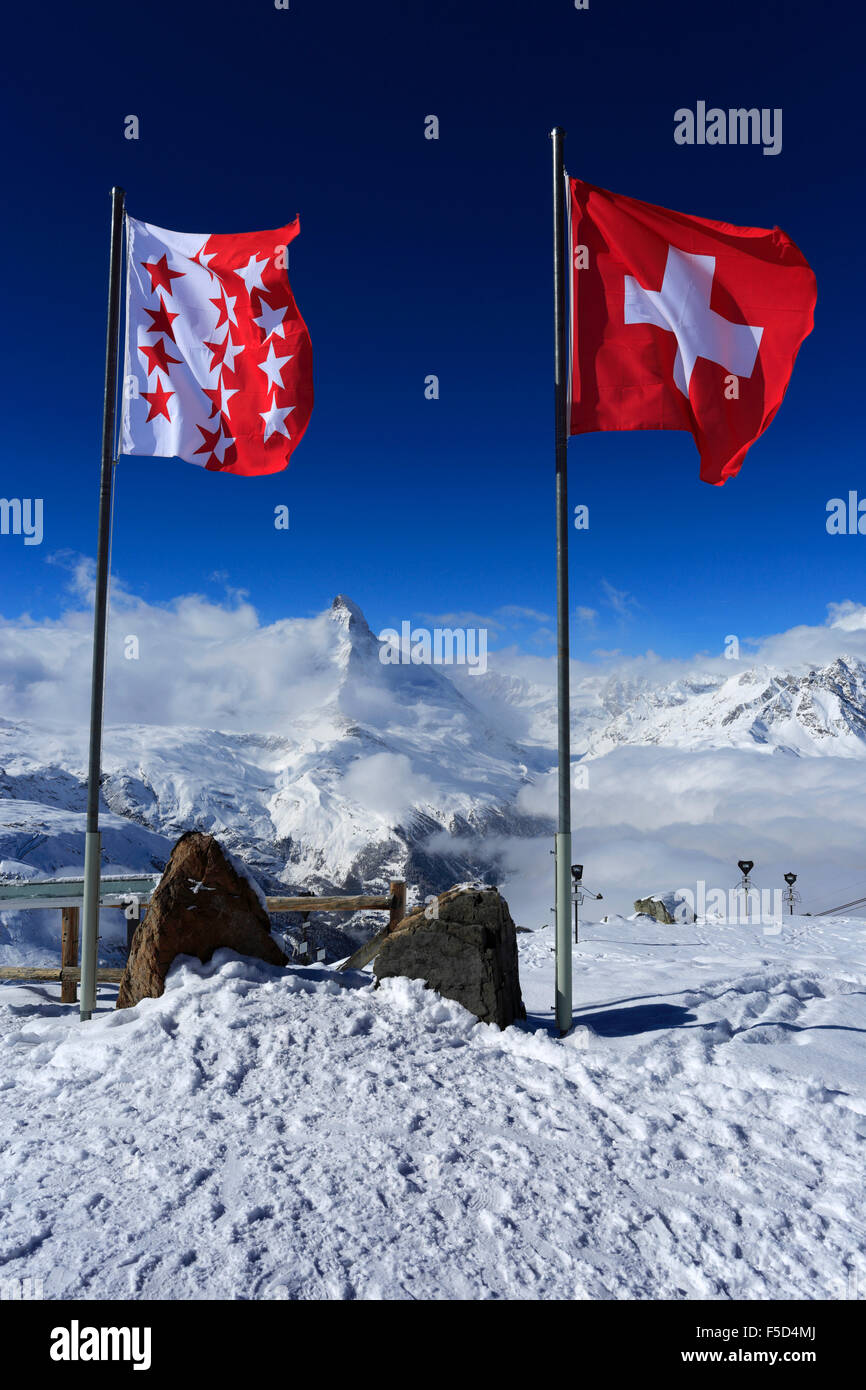 Flag of the Canton du Valais, and the Swiss national flag, Swiss Alps ...