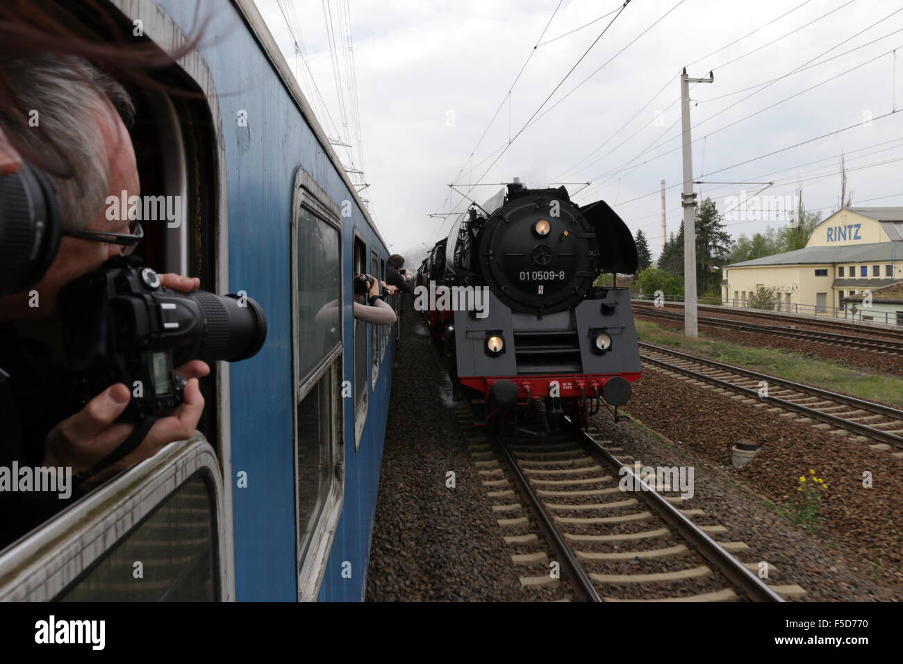 People taking photos of steam train Stock Photo - Alamy