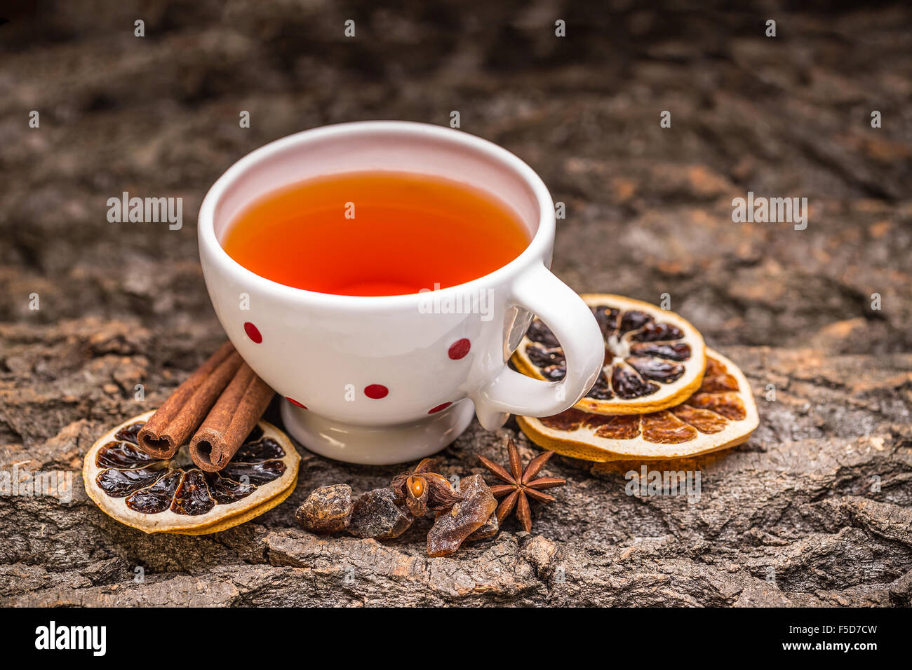 White cup of tea with red dots on bark in a festive mood Stock Photo ...