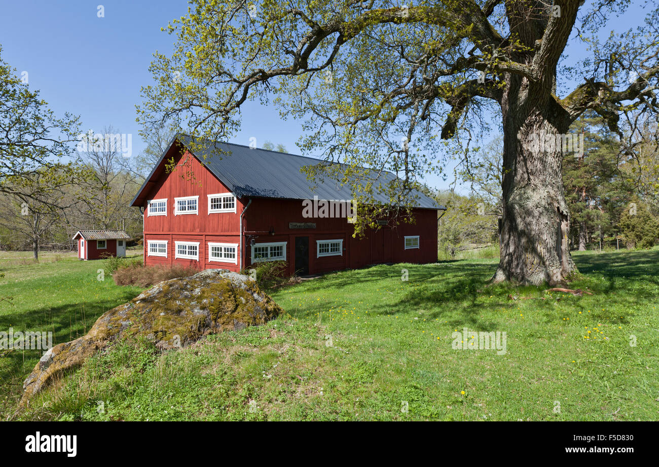 MALARDALEN, SWEDEN ON MAY 13, 2012. View of a red, well preserved barn ...