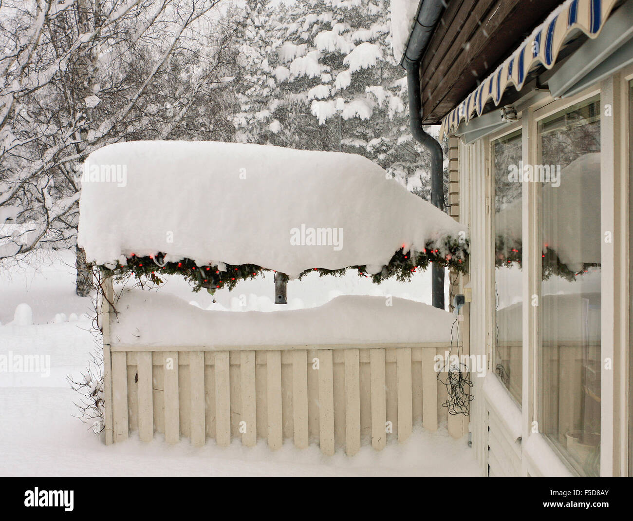 Newly fallen snow on the back porch. Heavy snowfall during the night ...
