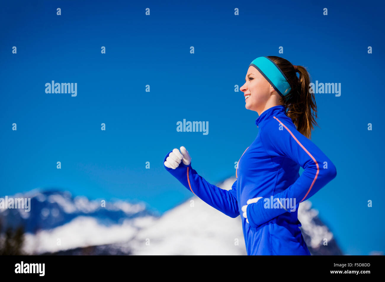 Woman running in mountains Stock Photo - Alamy