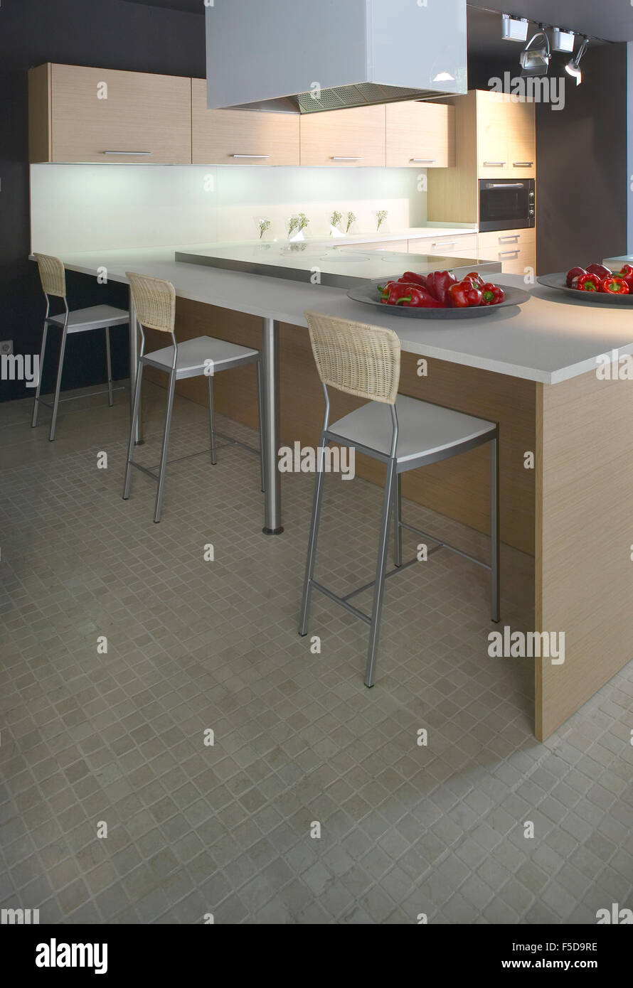 View of a domestic modern kitchen with cabinets, drawers and ceramic ...