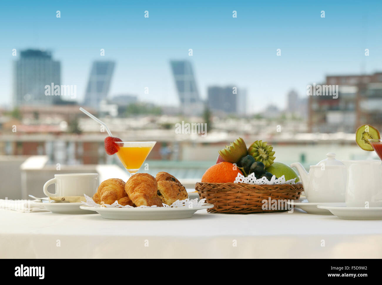Breakfast in a terrace of Madrid Hotel with buildings in the background ...