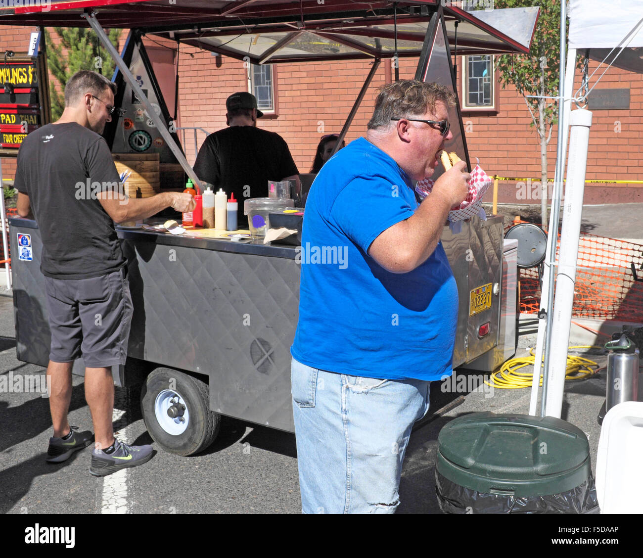 Fat Man Eating Chili Dogs