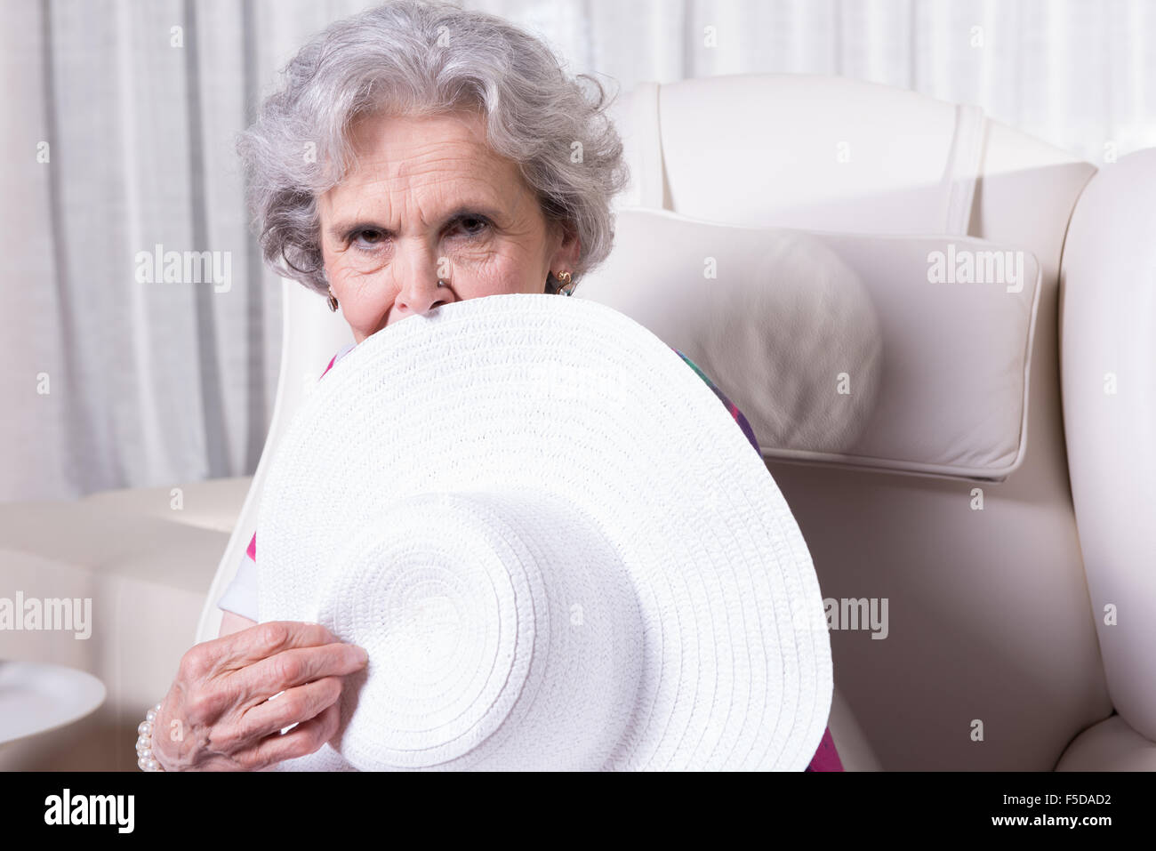 active female senior is waiting to go out Stock Photo - Alamy
