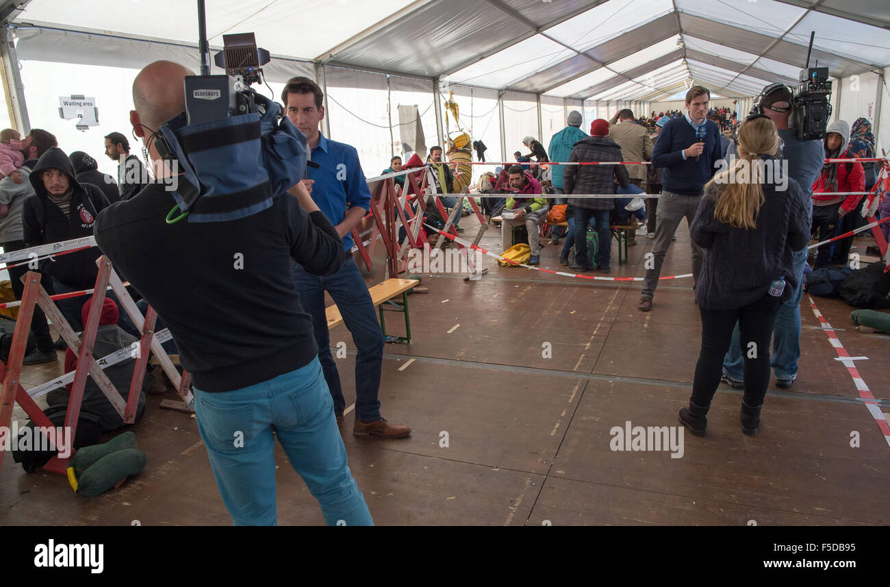 Hanging, Austria. 02nd Nov, 2015. German journalists report live from ...