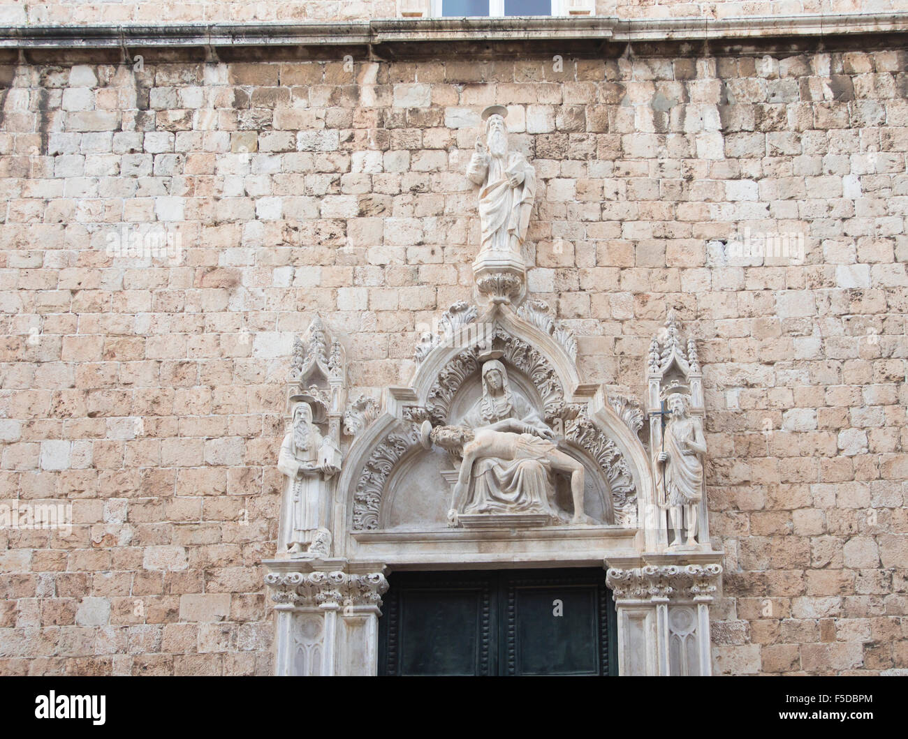 Religious Tableau above one of the doors, Franciscan Church in the old ...