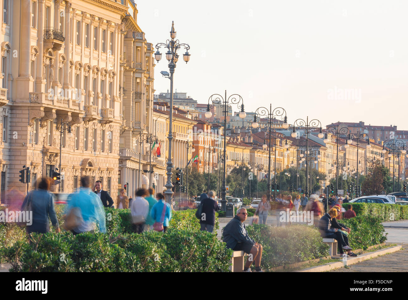 Passeggiata Italy, on a summer evening along the seafront in Trieste ...