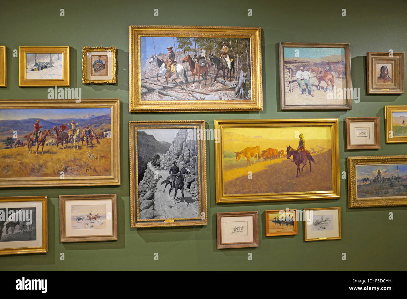 A wall of Fredrick Remington and Charles Russell paintings on display ...