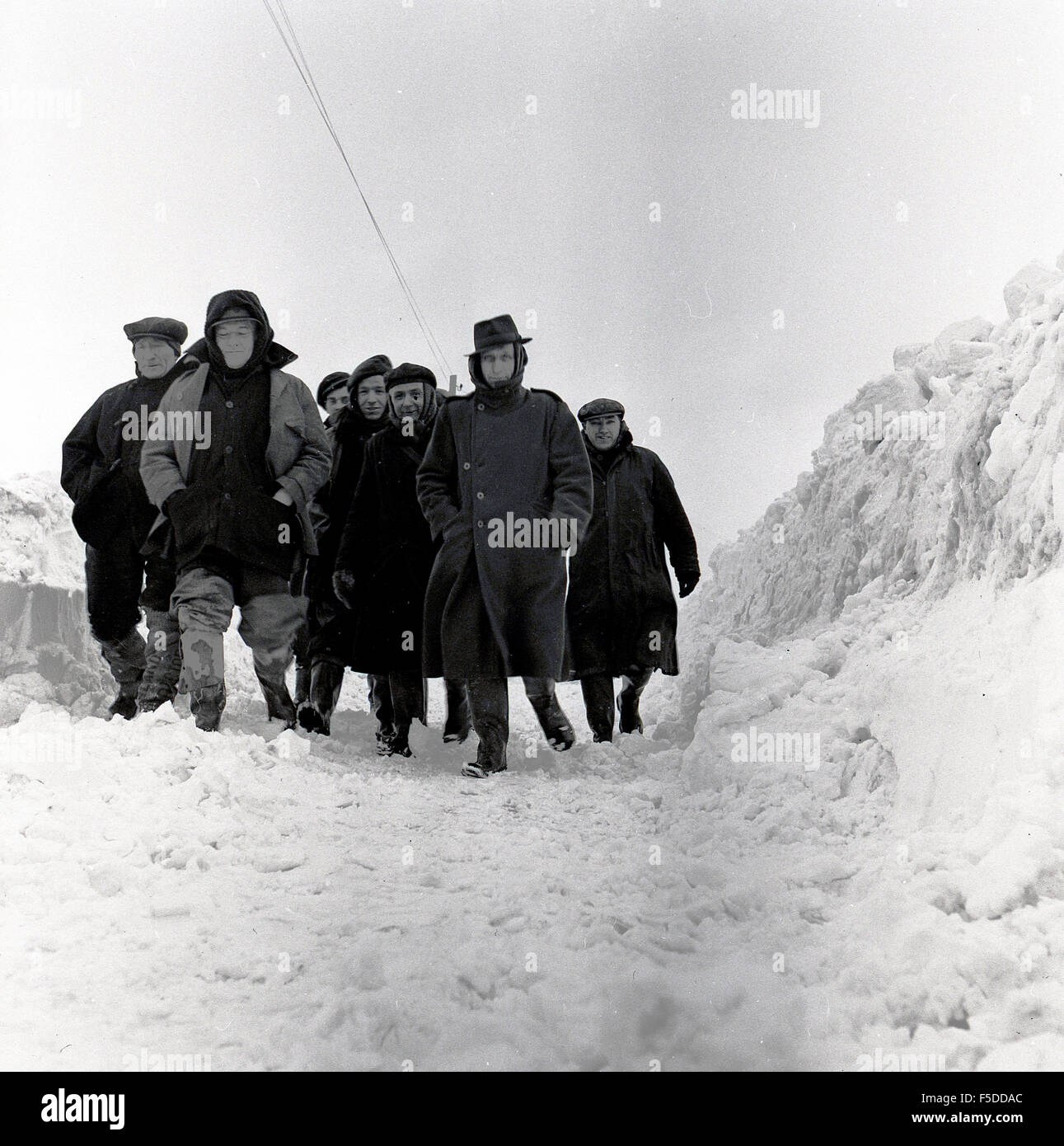 1950s historical, group of male construction workers walking together ...