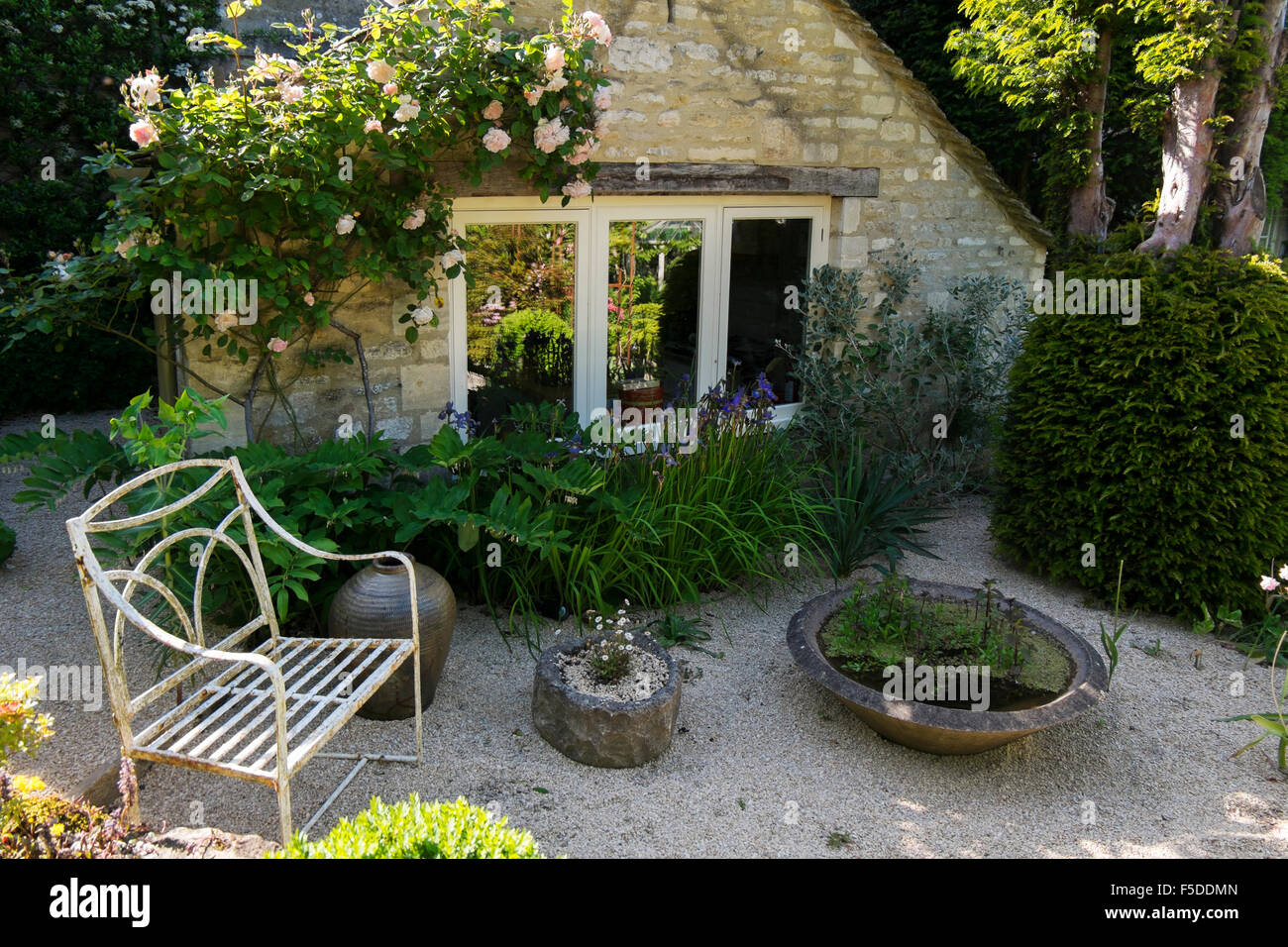 A chair next to an outbuilding in a beautiful garden in the Open ...