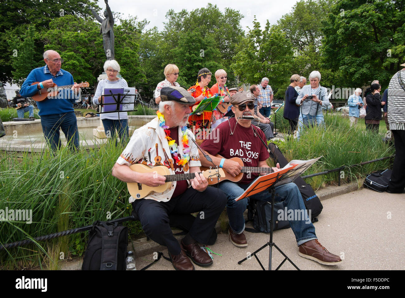 People playing ukuleles at the Big Busk, part of the Ukulele Festival ...
