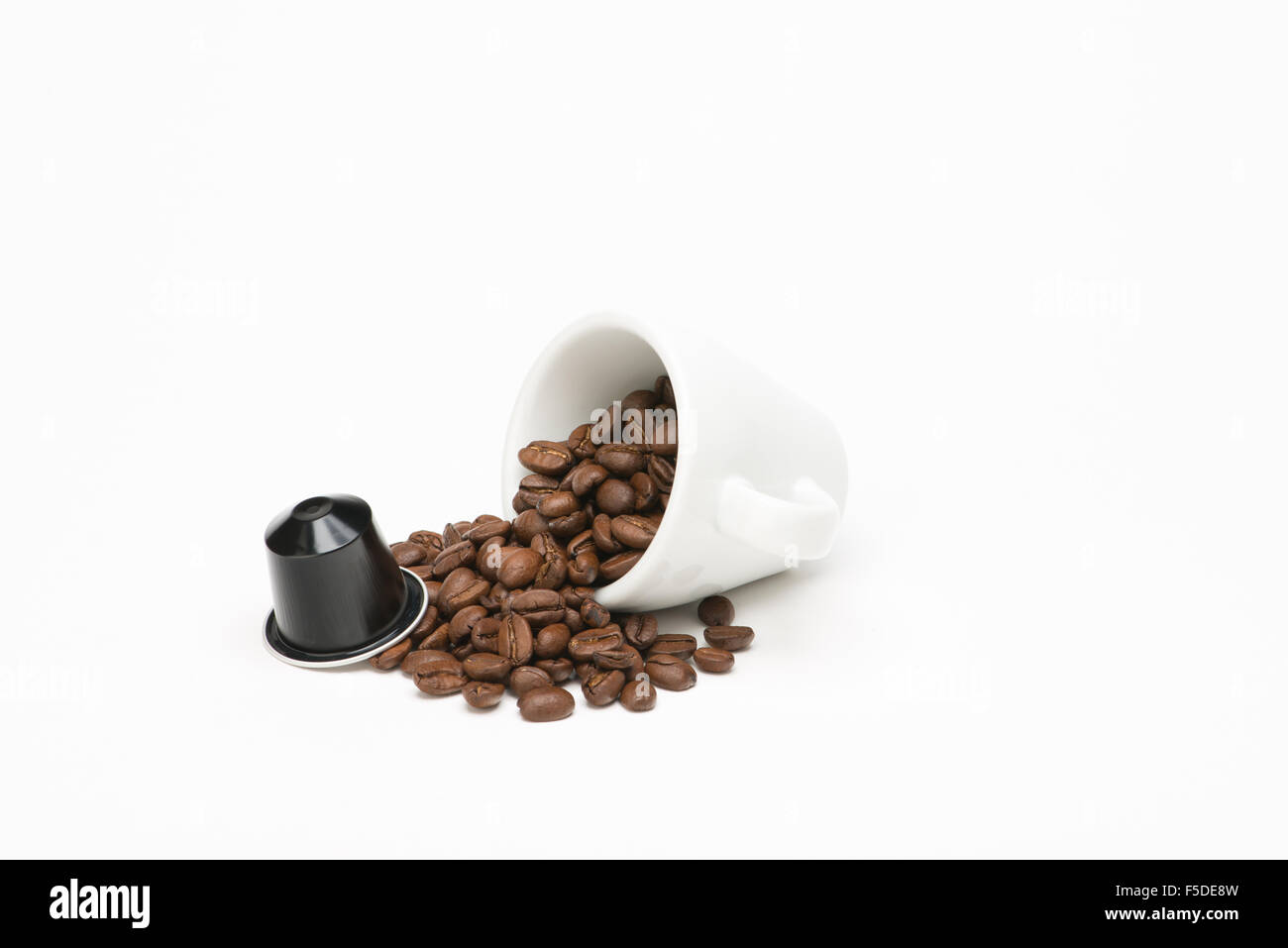 Seed of coffee with capsule on white background Stock Photo - Alamy