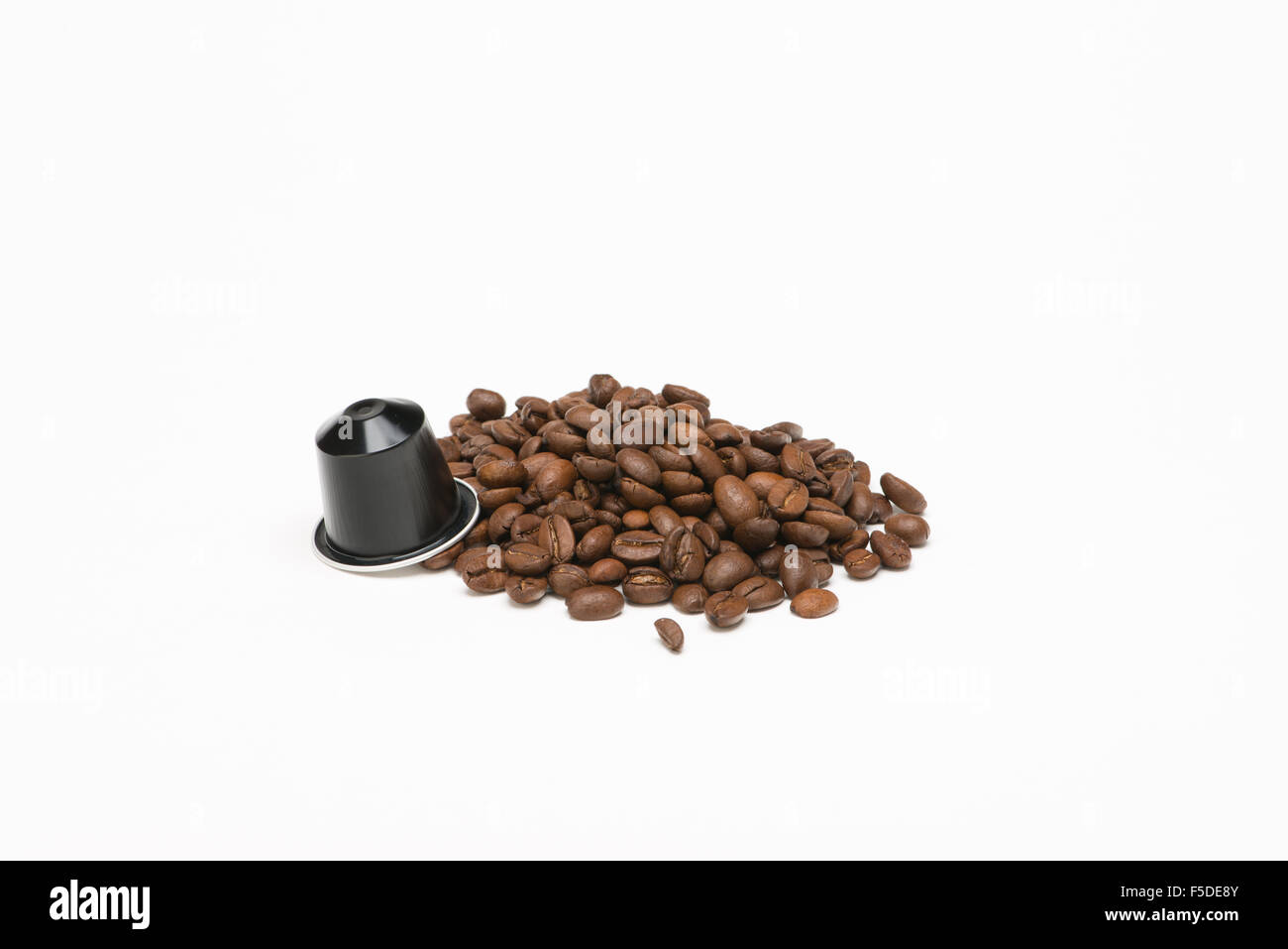 Seed of coffee with capsule on white background Stock Photo - Alamy