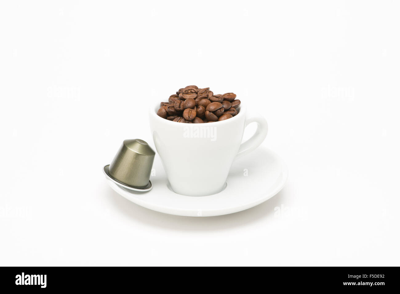 Seed of coffee with capsule on white background Stock Photo - Alamy