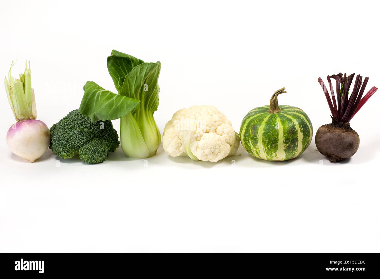 A selection of miniature vegetables on a white background Stock Photo ...