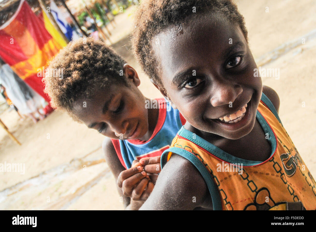 A young Walan boy smiles into the camera in Wala the Pacific Islands ...