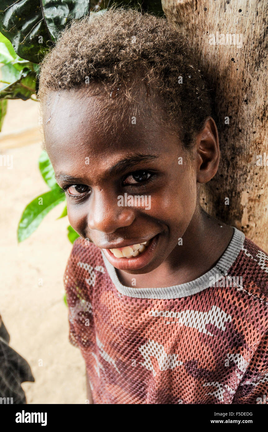 A young Walan boy smiles into the camera in Wala the Pacific Islands ...