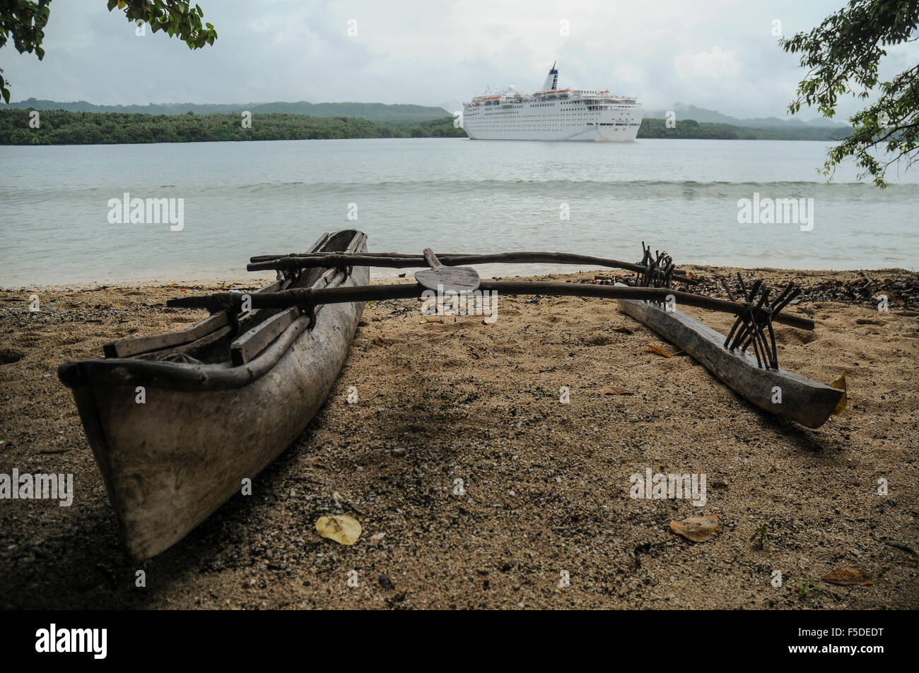A native boat in the foreground with P&O cruise ship in the background ...