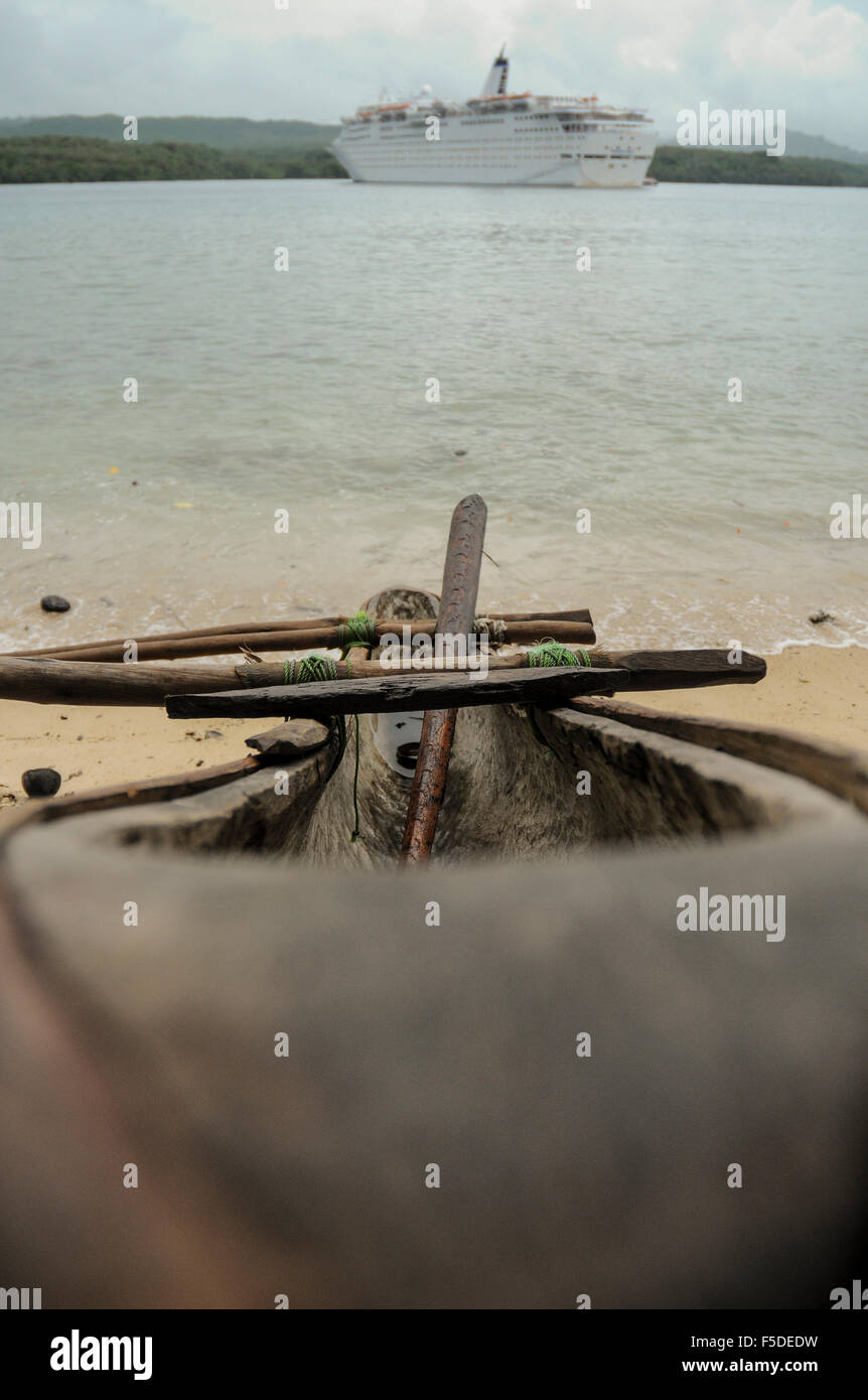 A native boat in the foreground with P&O cruise ship in the background ...