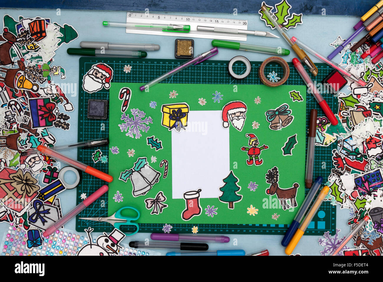 a horizontal overhead view of a scrapbook xmas layout with some of the ...