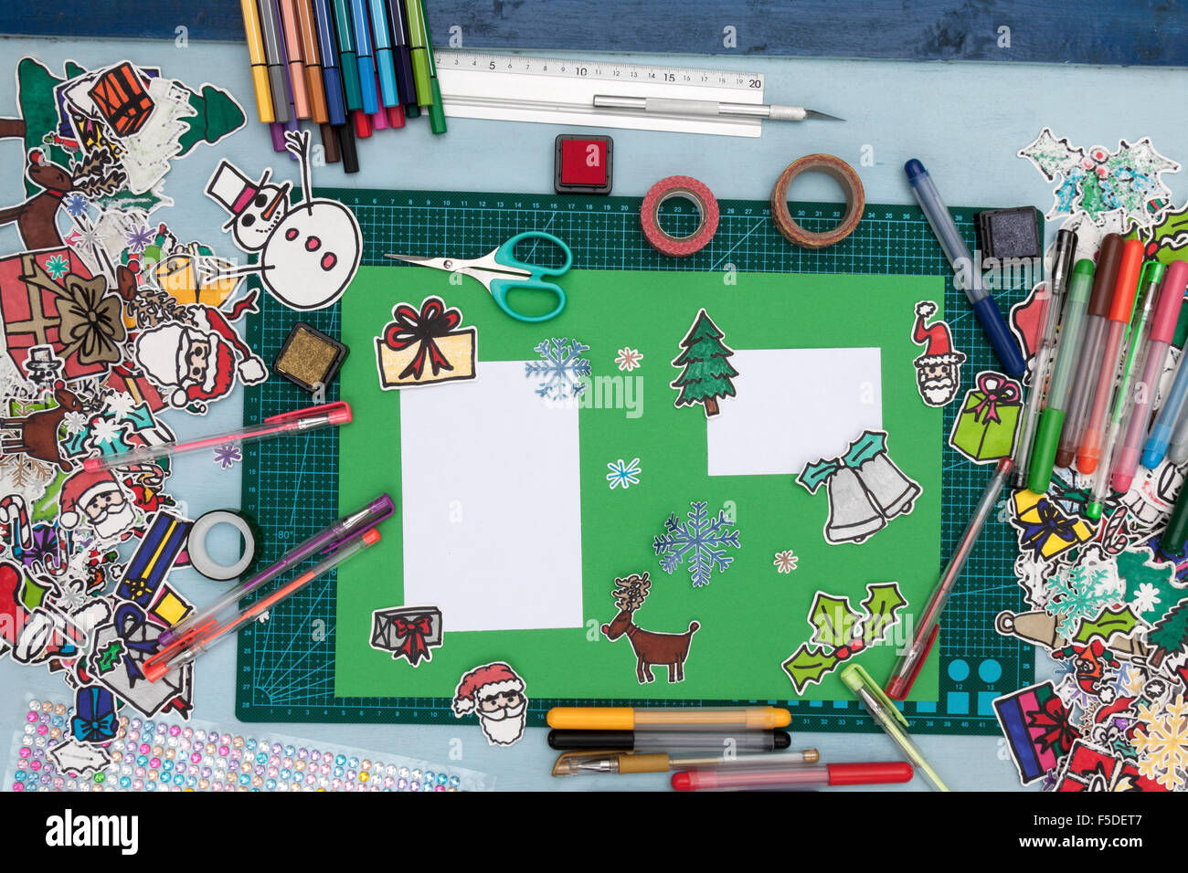 a horizontal overhead view of a scrapbook xmas layout with some of the ...